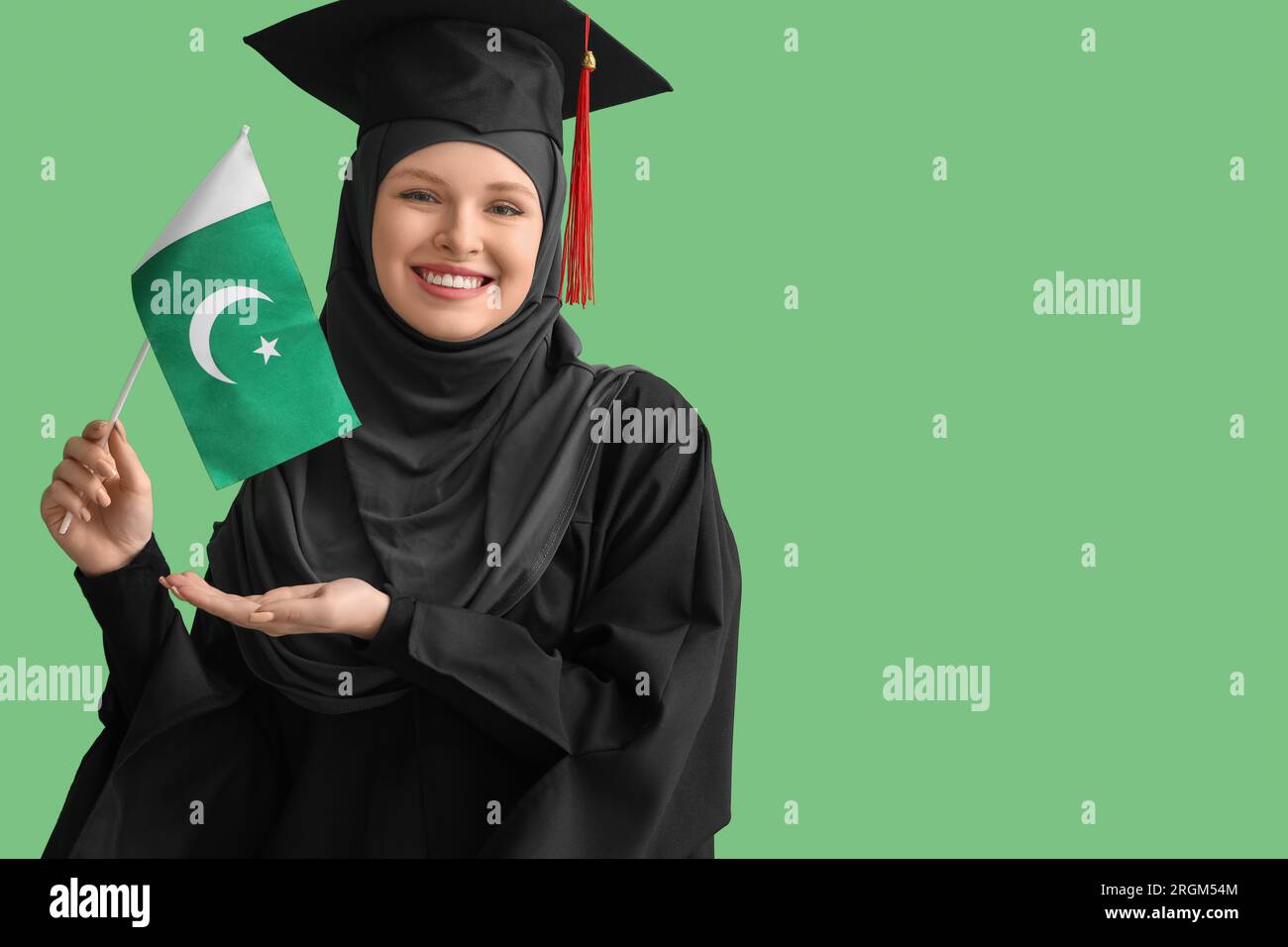 Islamic graduate student with flag of Pakistan on green background ...