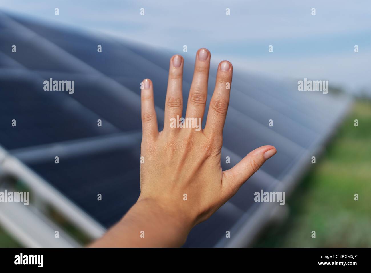 Human hand on solar panel blurred background, photovoltaic, alternative ...