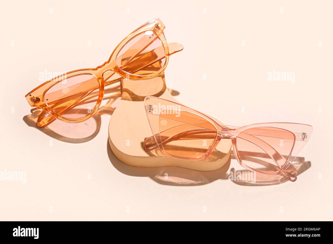 Decorative podium with stylish sunglasses on pink background Stock ...
