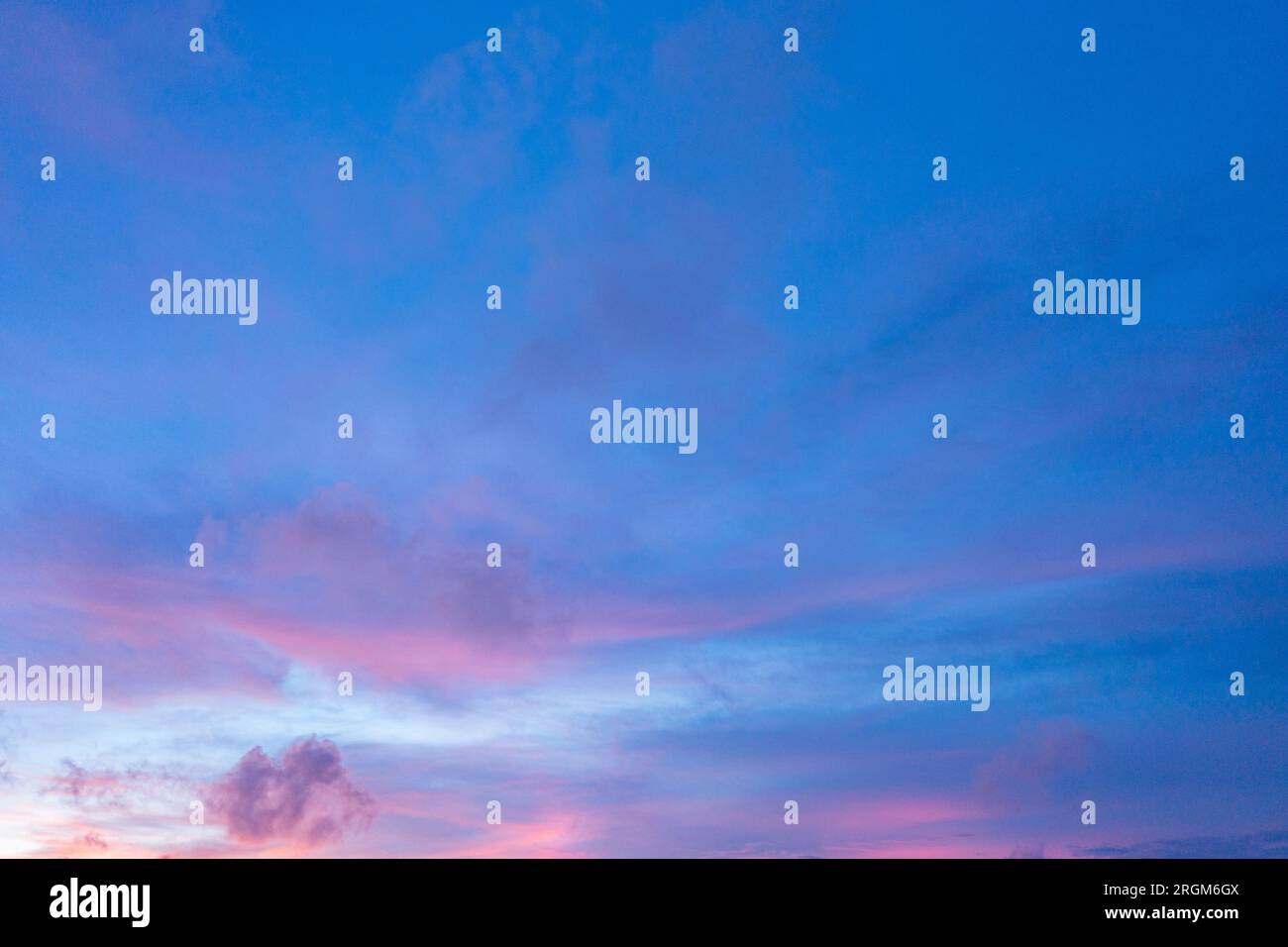 Scene of colorful pink light trough in the sky above the ocean. Scene ...