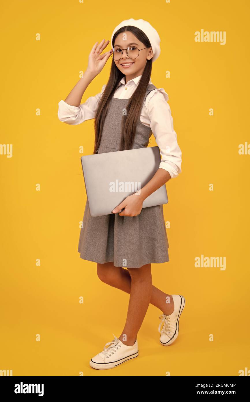 Young student school girl, studying with laptop computer. E-learning ...