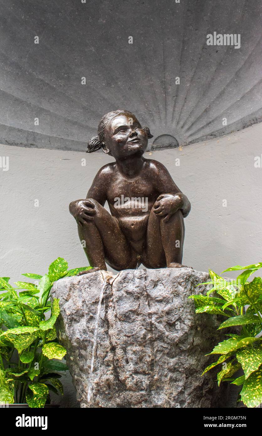 Brussels, Belgium - 08 09 2023 : the bronze statue of Jeanneke-Pis in ...