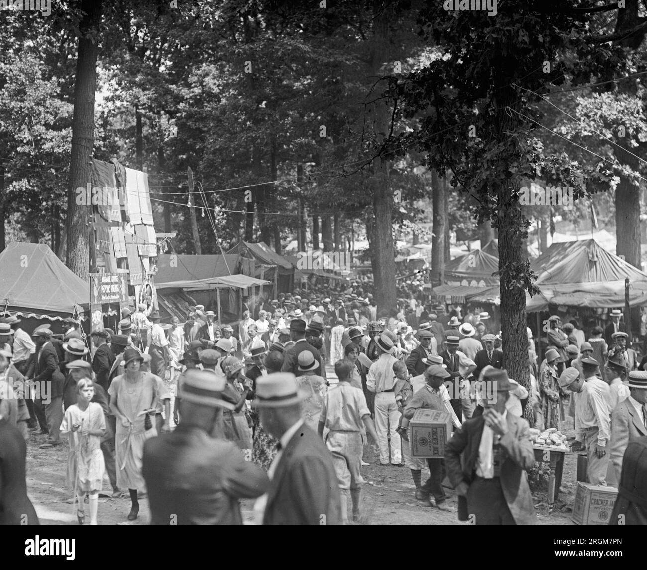 Visitors enjoying a good time amongst exhibits and vendor booths at the ...
