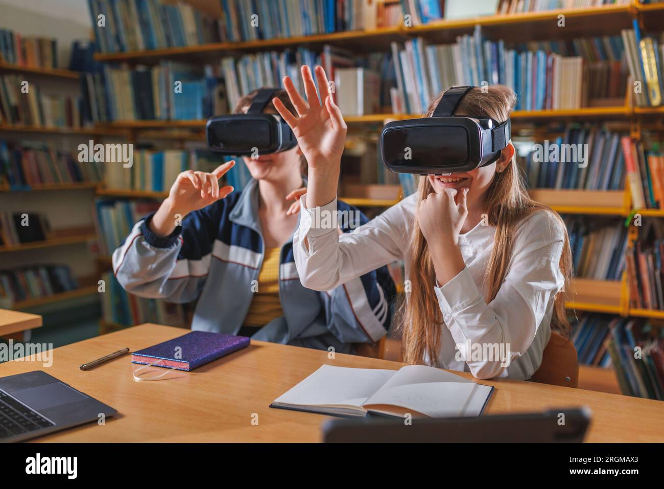 School students use laptop headset hi-res stock photography and images ...