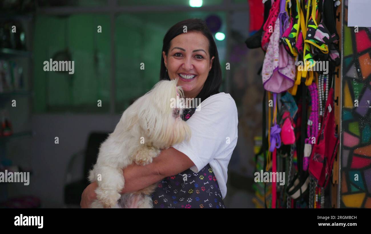 Happy Pet Store Owner. Smiling, Holding Small Dog, Portrait of Female ...