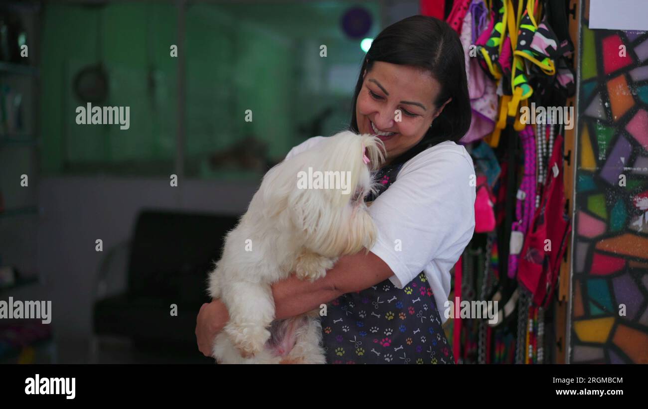 Happy Pet Store Owner. Smiling, Holding Small Dog, Portrait of Female ...