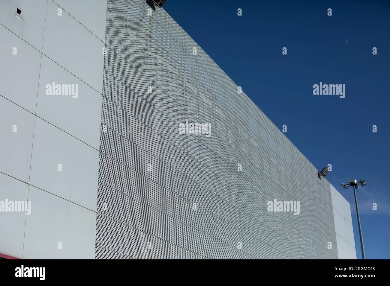 Grey building on sunny day. Wall without windows. Modern architecture ...