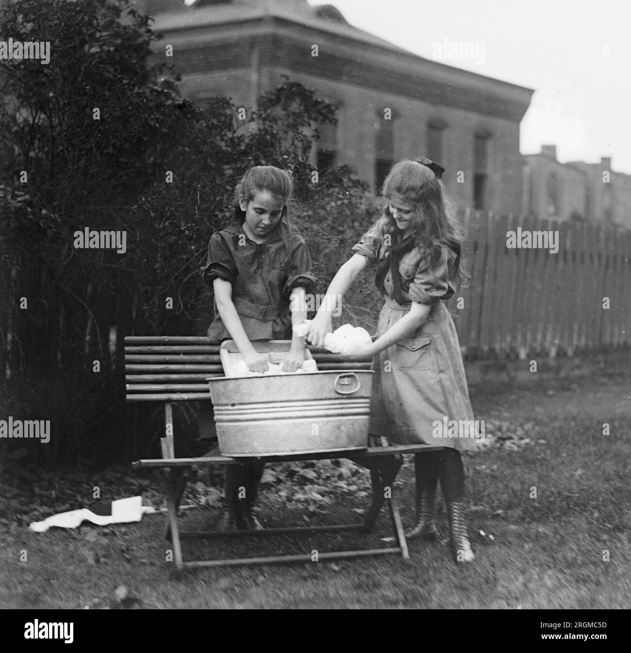 Two girls washing clothes ca. 1920 Stock Photo - Alamy