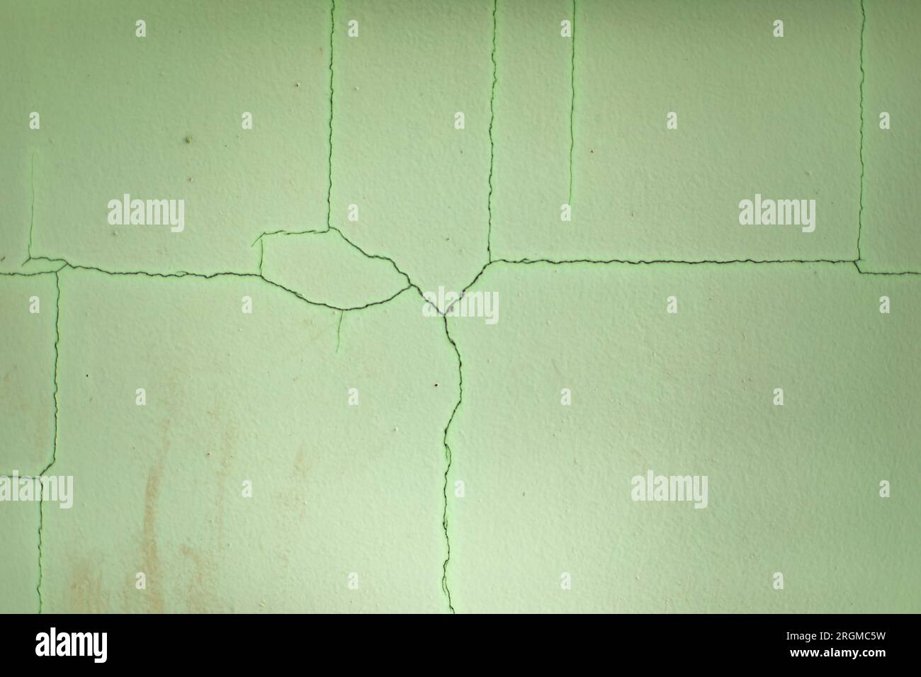 Cracks on wall. Scratches on green background. Old paint. Surface crack ...