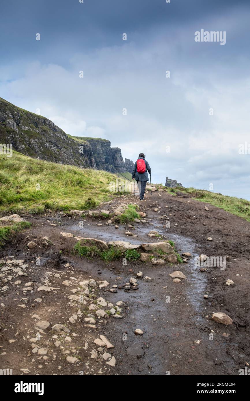 Female hiker walking at the Quiraing on the Isle of Skye, Scotland, UK ...