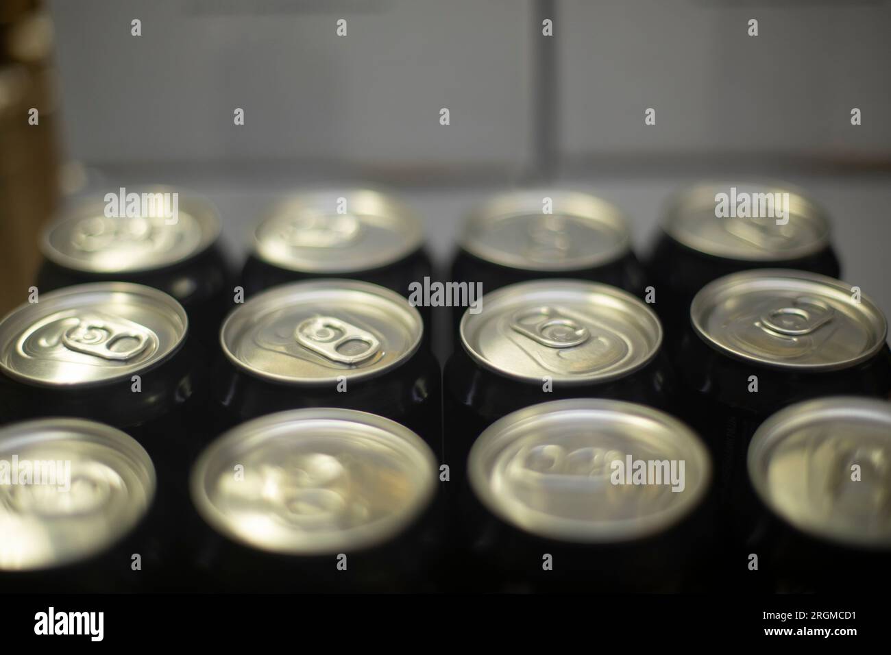 Cans with drink. Carbonated alcohol. Aluminum cans stand in row. Goods ...