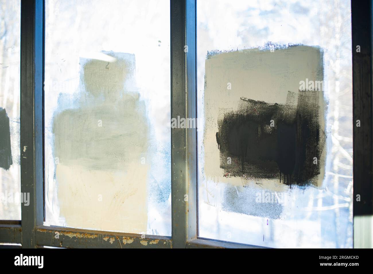 Graffiti vandalism. Painted over inscription. White paint stains on ...