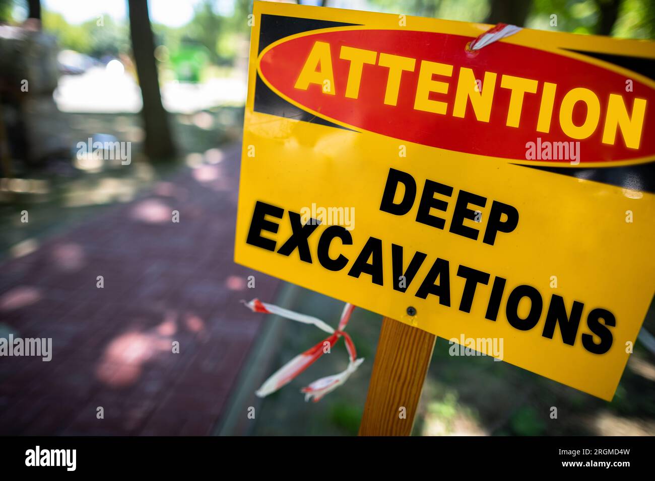 Beware of deep excavations - plastic warning sign posted on the ...