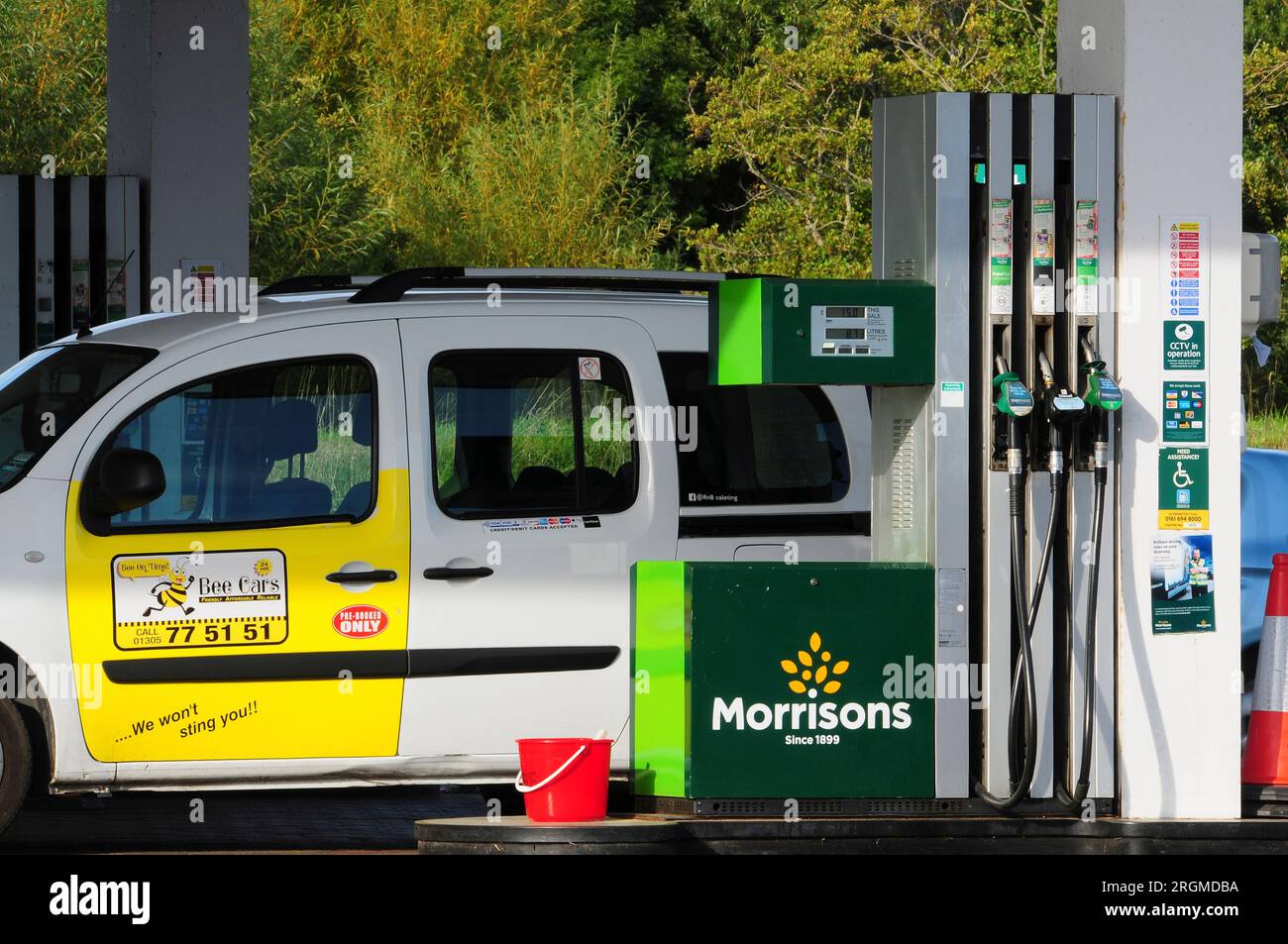 Taxi filling up in Morrisons petrol station Stock Photo - Alamy
