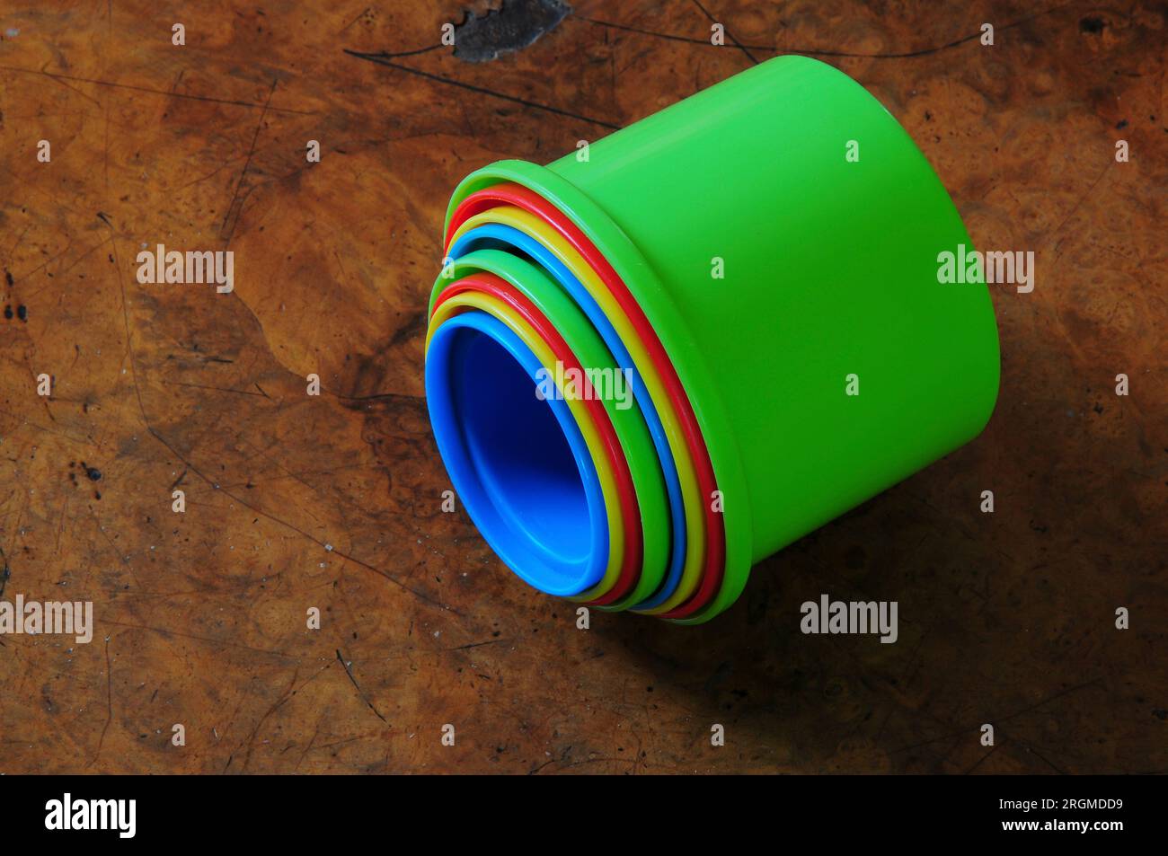 Colourful stacking cups or beakers toy Stock Photo - Alamy