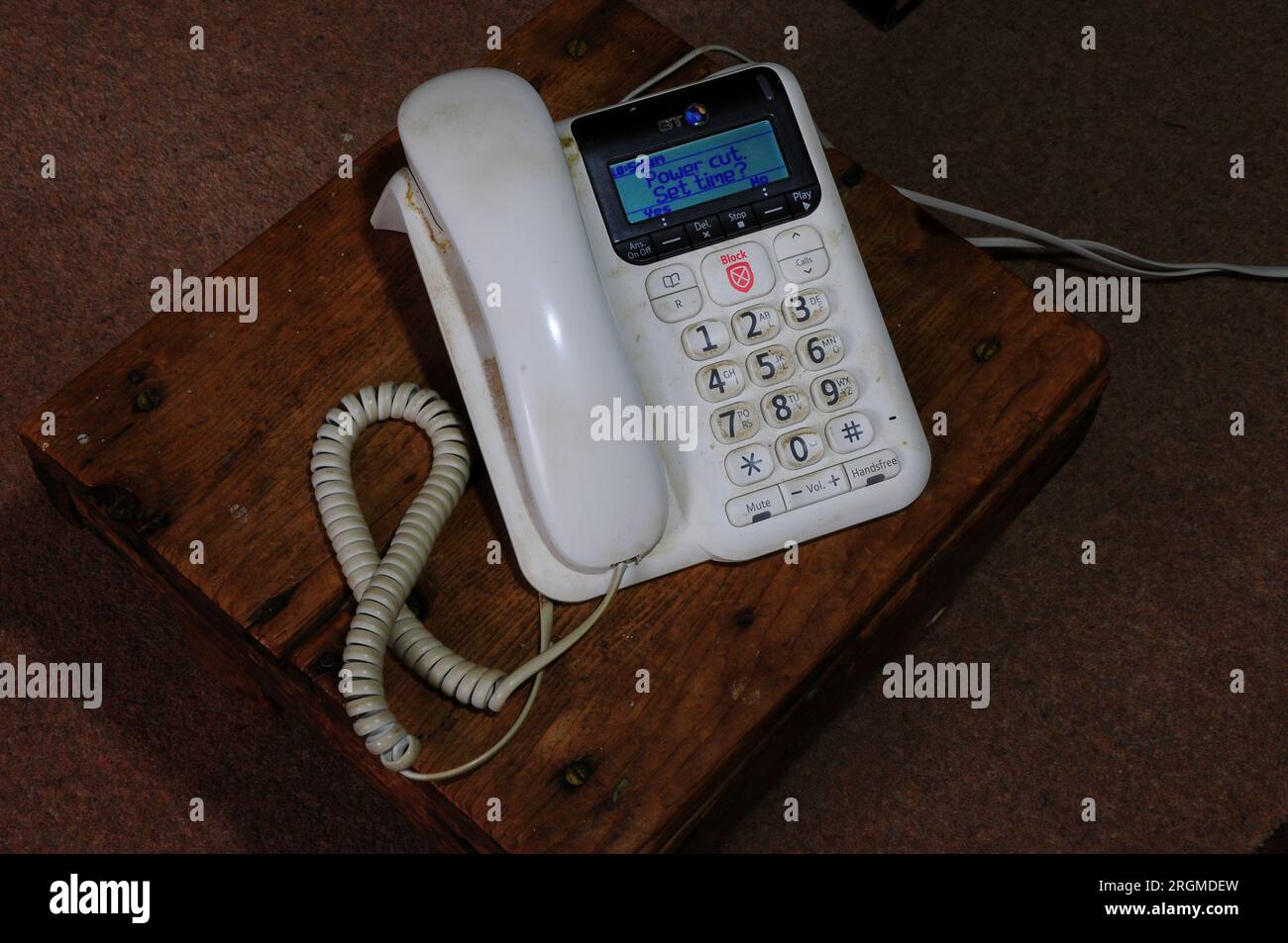 Old fashioned white corded telephone with large numbers Stock Photo - Alamy