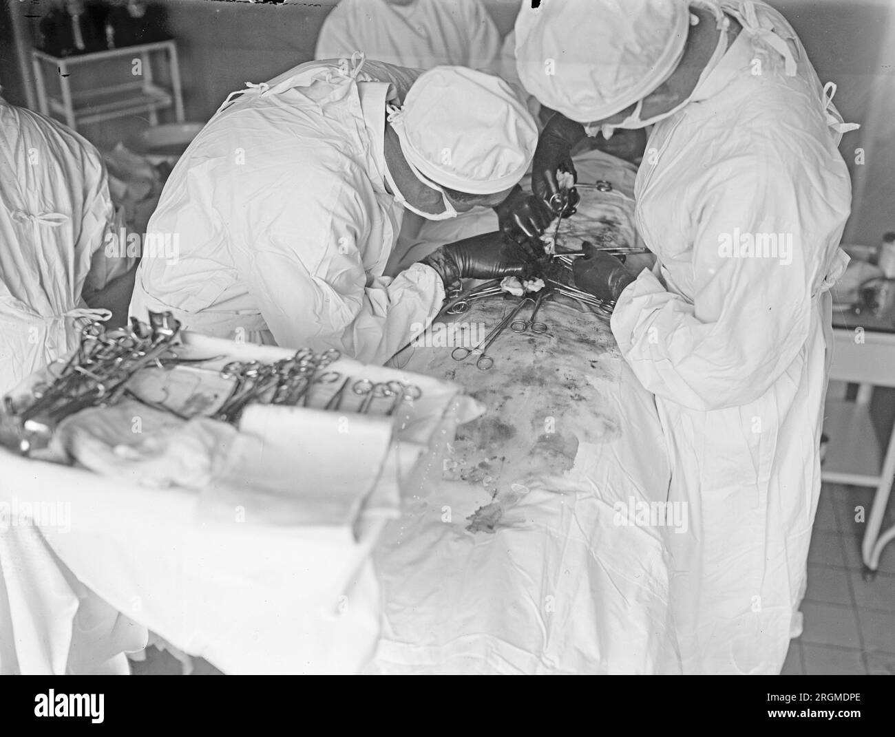 A patient in an operating room during surgery ca. 1922 Stock Photo - Alamy