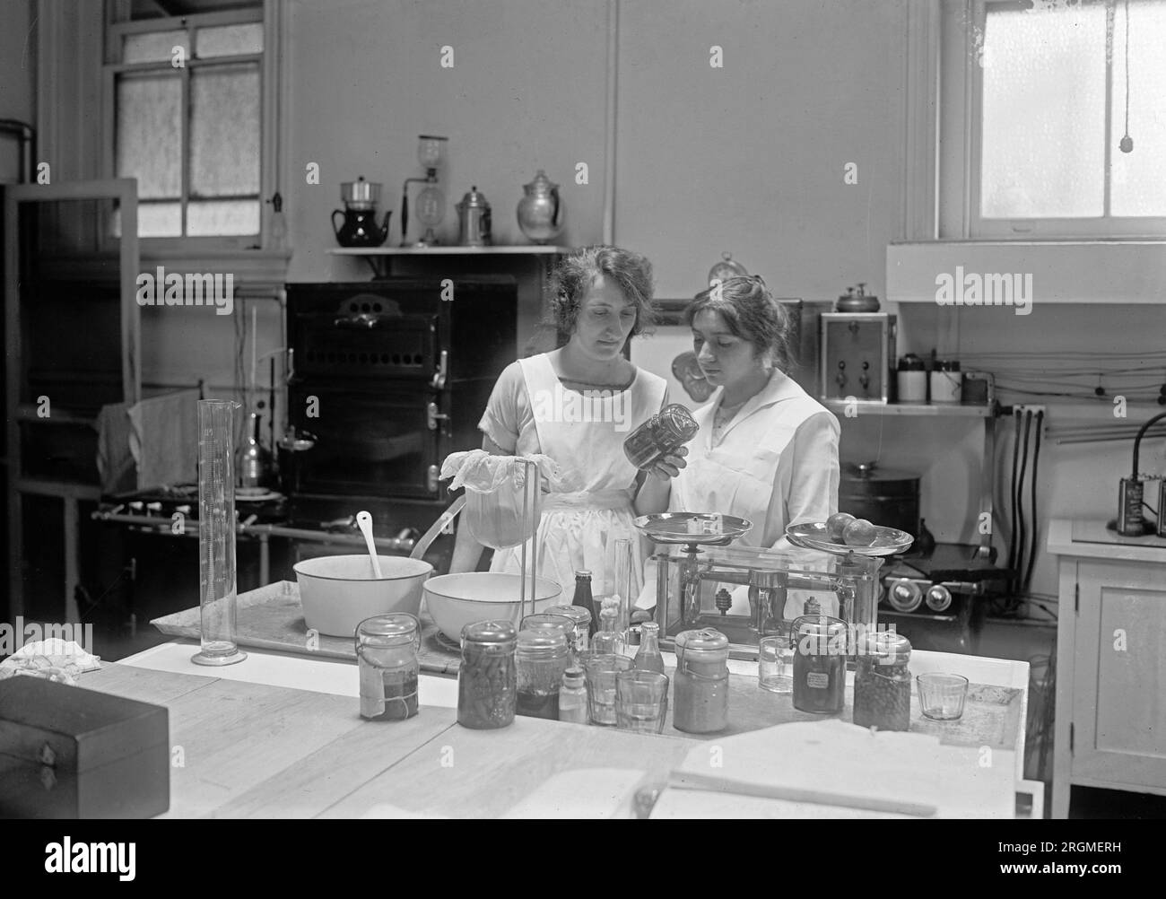 Two women in kitchen Black and White Stock Photos & Images - Alamy
