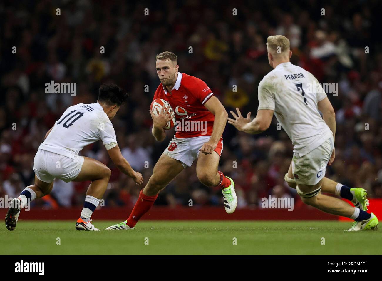 Wales' Max Llewellyn with England's Marcus Smith (left) and Jan Morgan ...