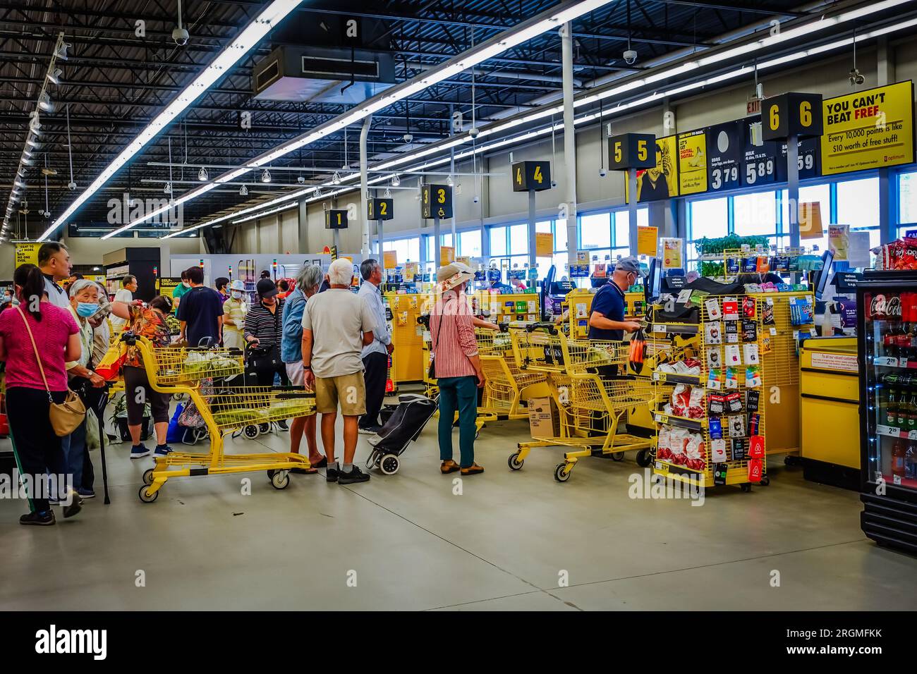 Long line up at a supermarket checkout line, view from the side Stock ... Long line up at a supermarket checkout line, view from the side Stock ...