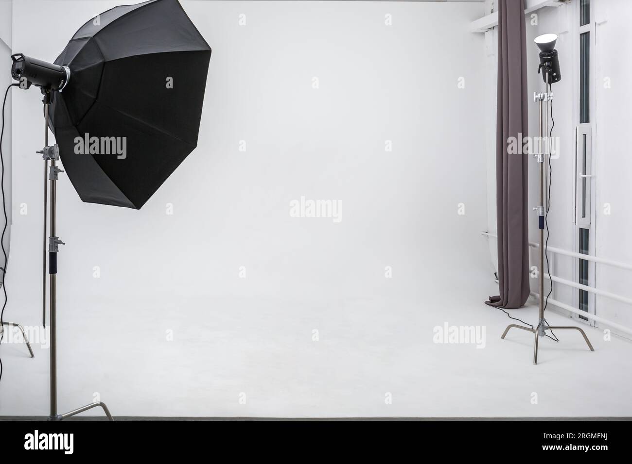 interior of bright space of photo studio with large white cyclorama ...