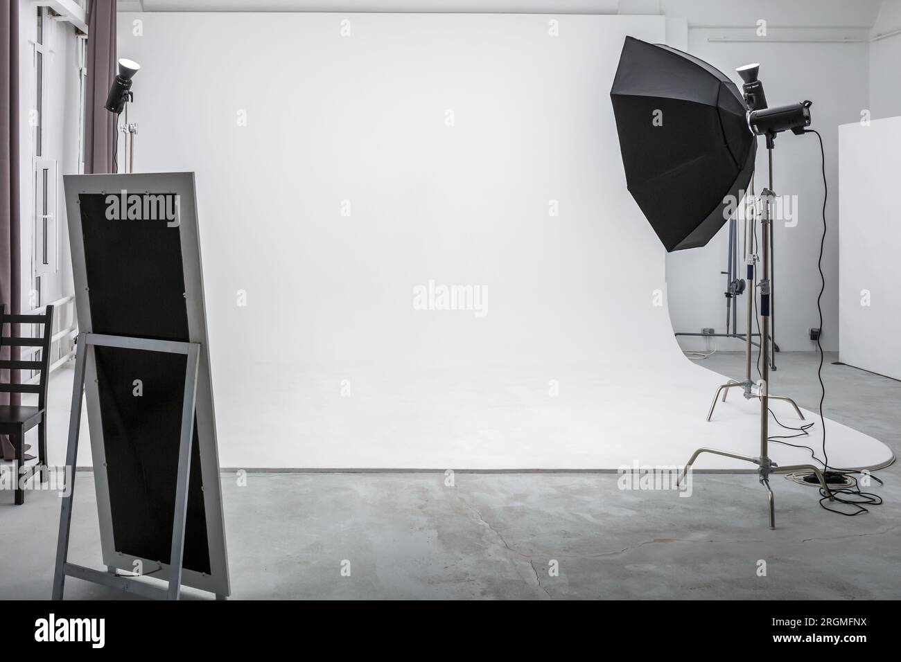 interior of bright space of photo studio with large white cyclorama ...