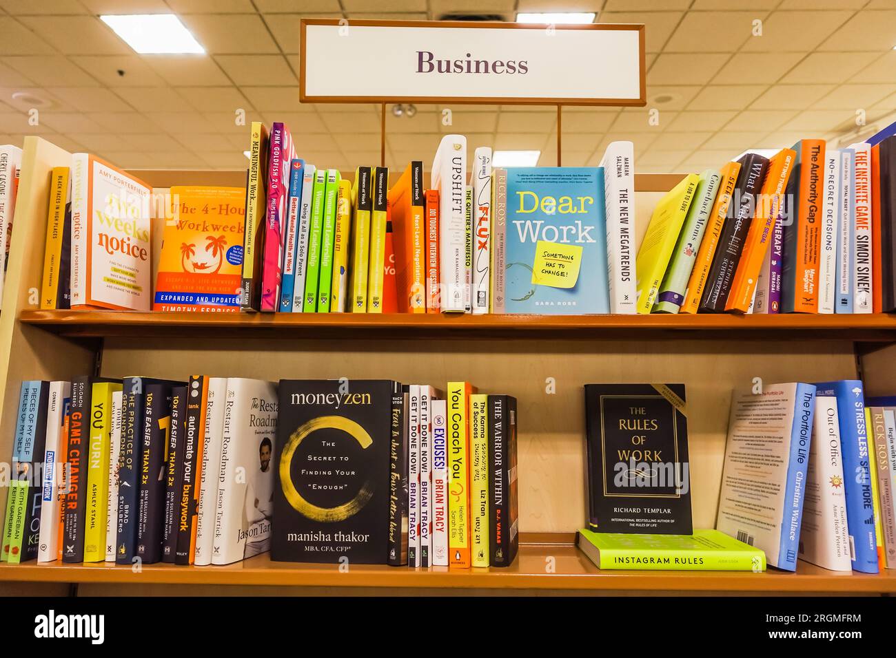 rows of business books on a bookshelf in a bookstore Stock Photo - Alamy