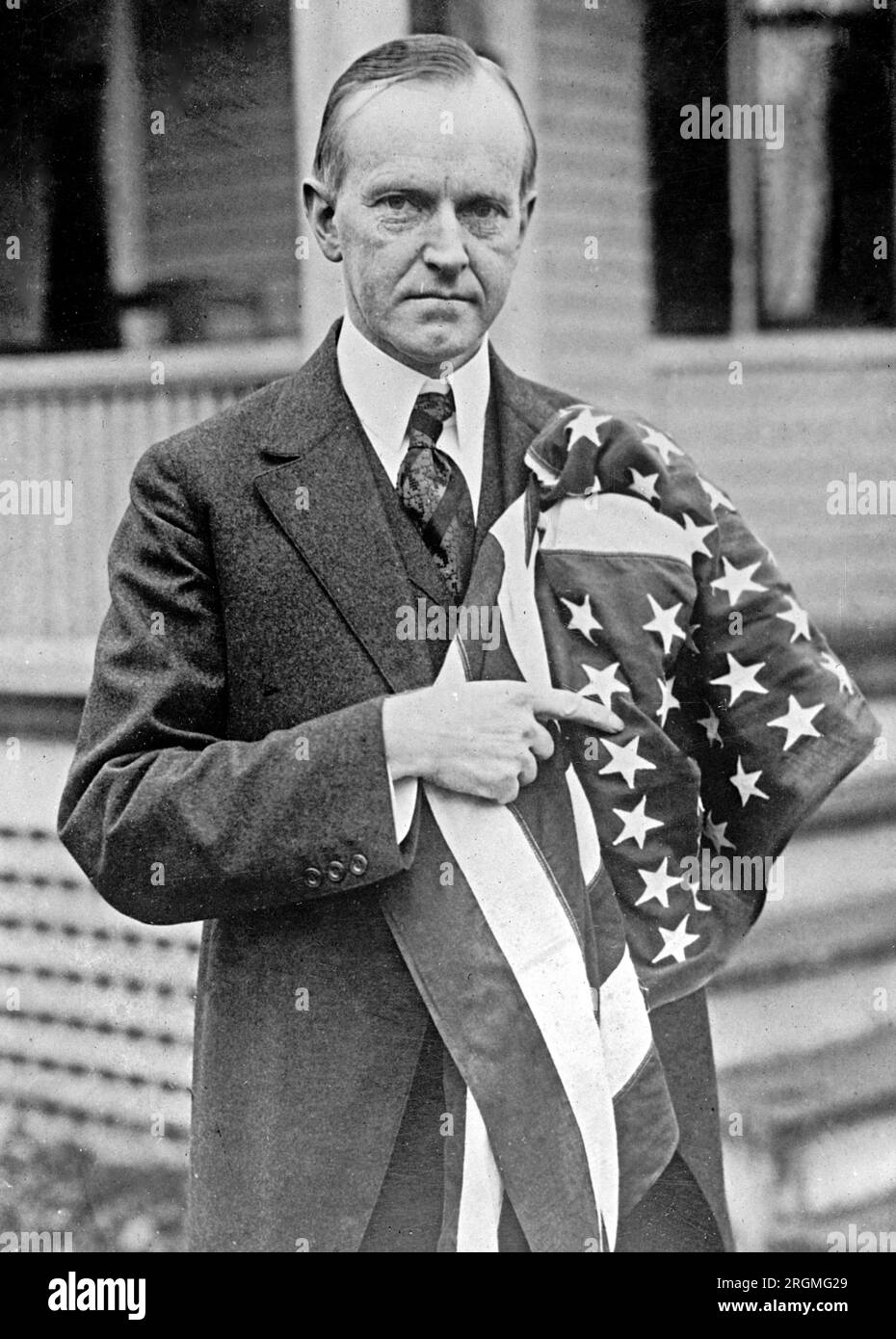 Calvin Coolidge holding a United States flag ca. 1924 Stock Photo - Alamy