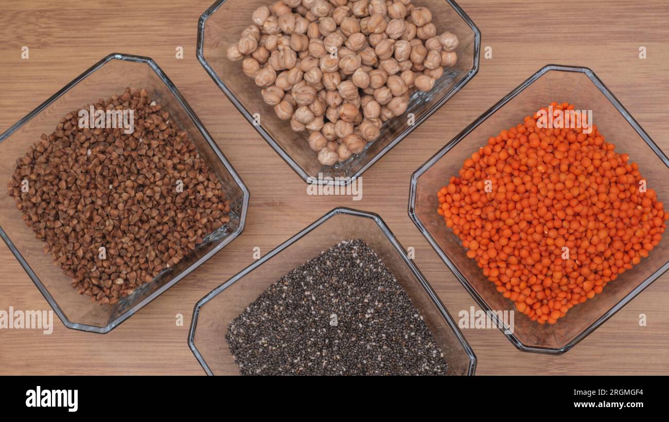 Four different types of cereals: buckwheat, nohut ,red lentils, chia ...