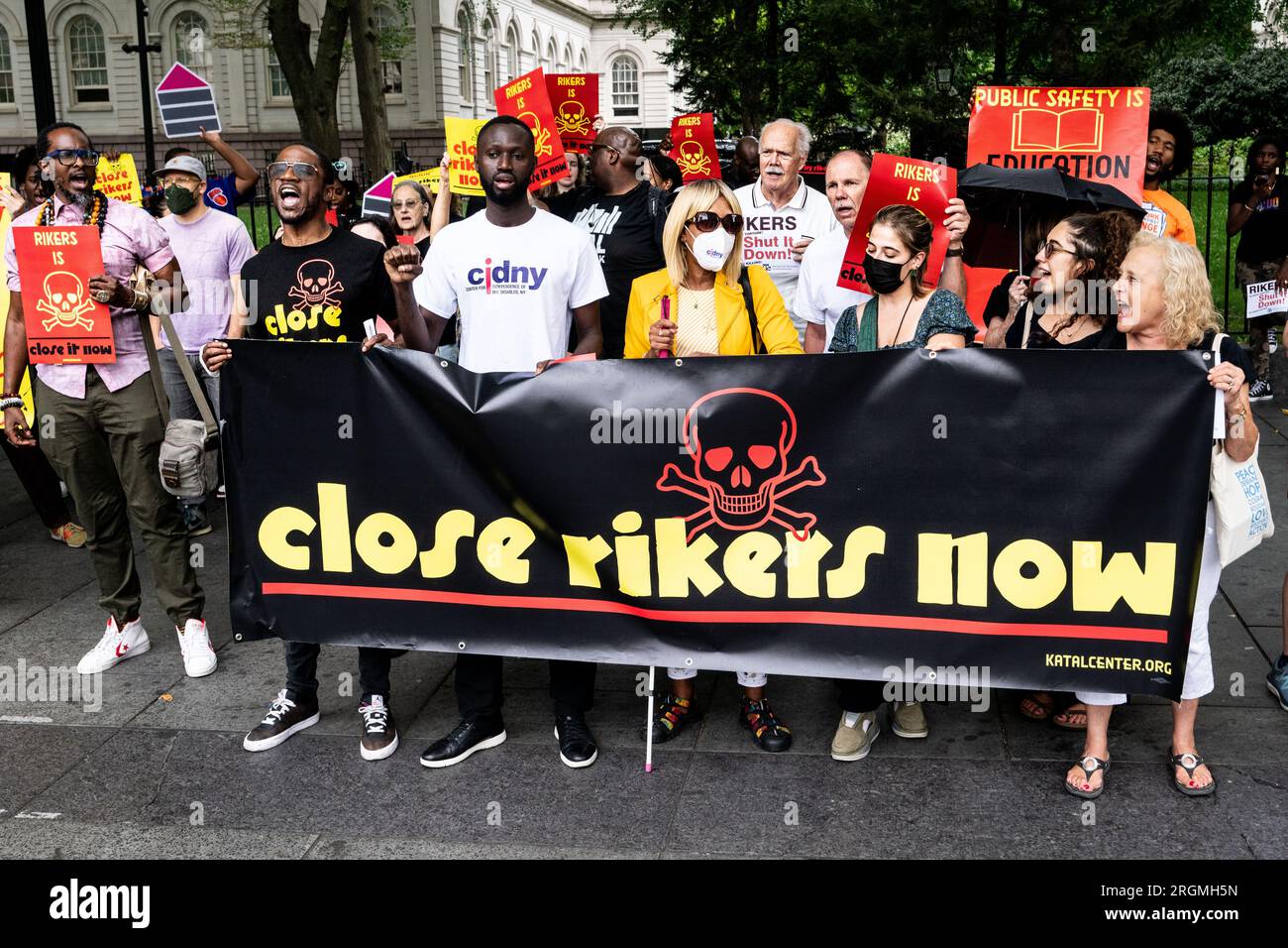 New York, United States. 10th Aug, 2023. People holding a banner saying ...
