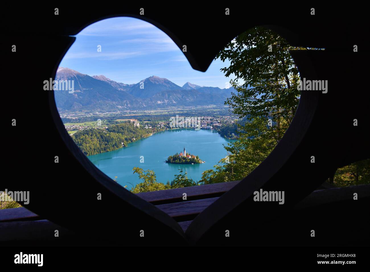 View of Bled lake with an island through a heart shaped window in ...
