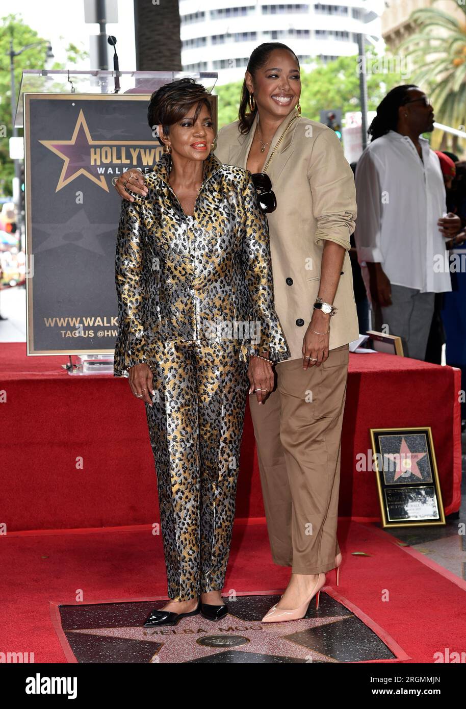 Actress and singer Melba Moore, left, poses atop her star on the Hollywood Walk of Fame with ...