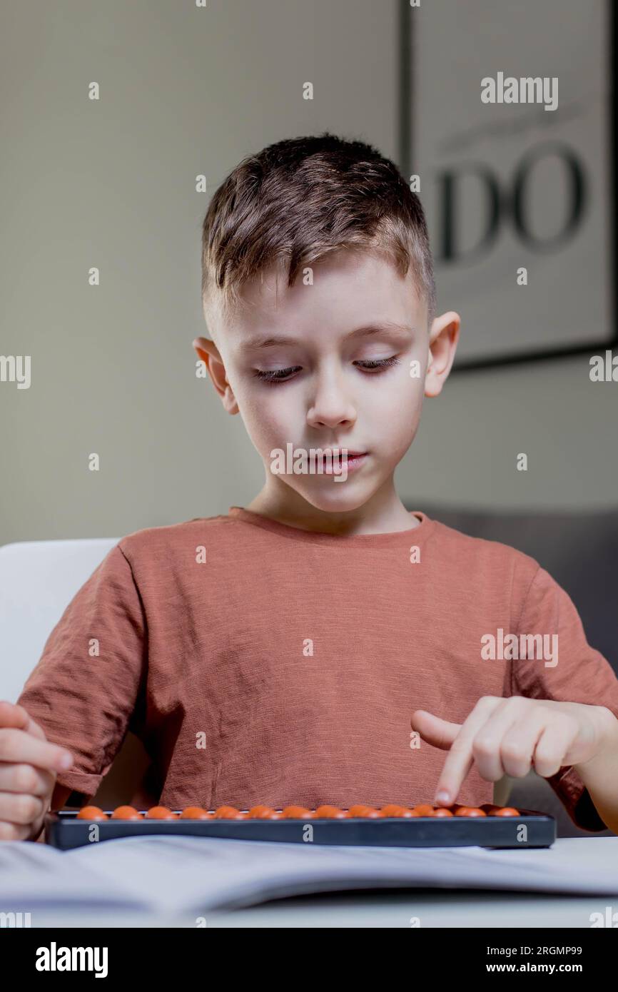 Smart cute boy thinking math hi-res stock photography and images - Alamy