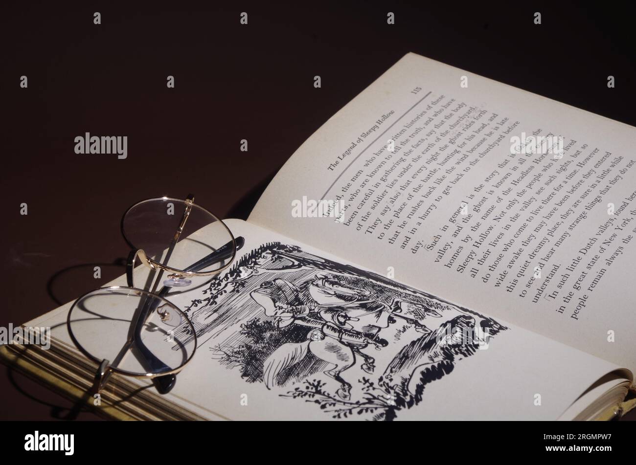 Book reading lenses and rose Stock Photo - Alamy