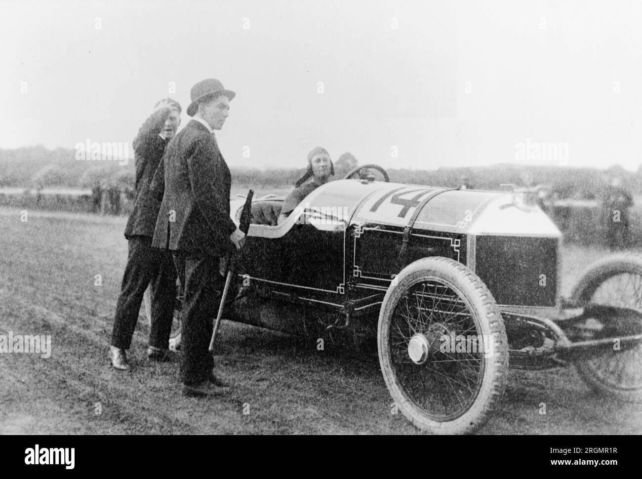 Vintage Auto Racing: Two men looking at racing automobile no. 14 on ...