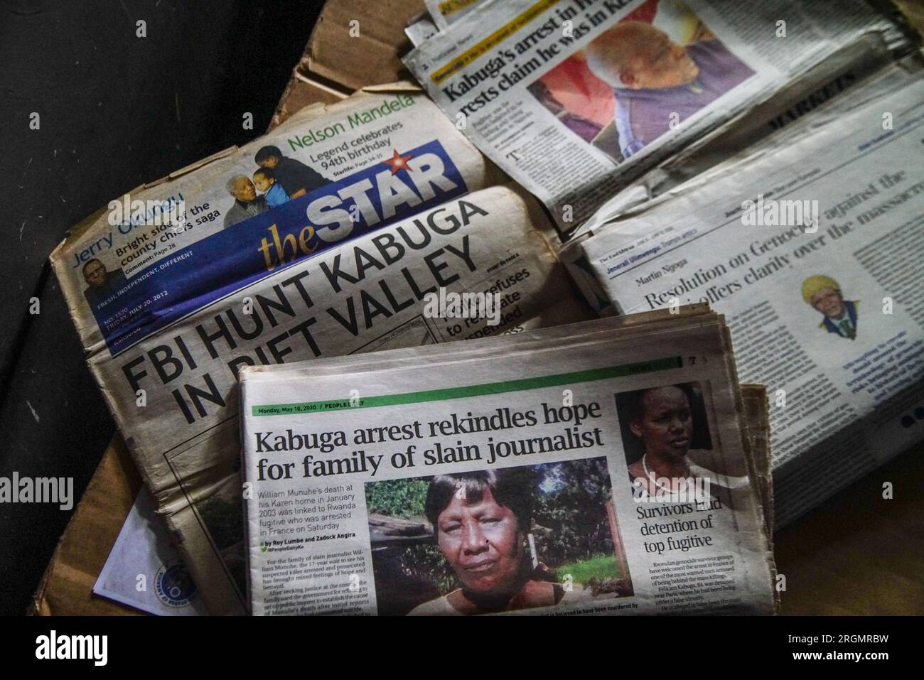 A view of old Kenyan newspapers that covered the story of suspected ...