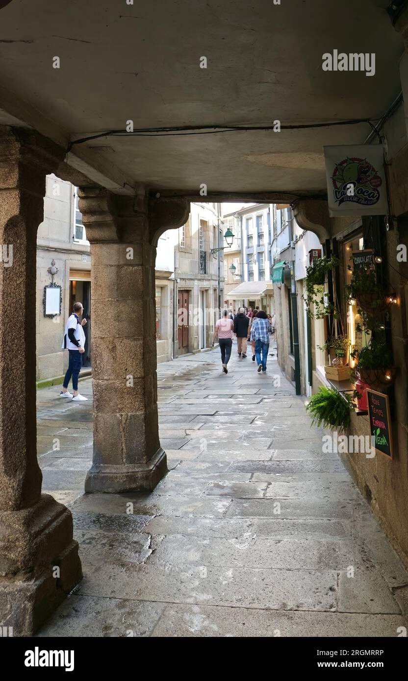 Historic city centre shopping arcade covered walkway with stone columns ...