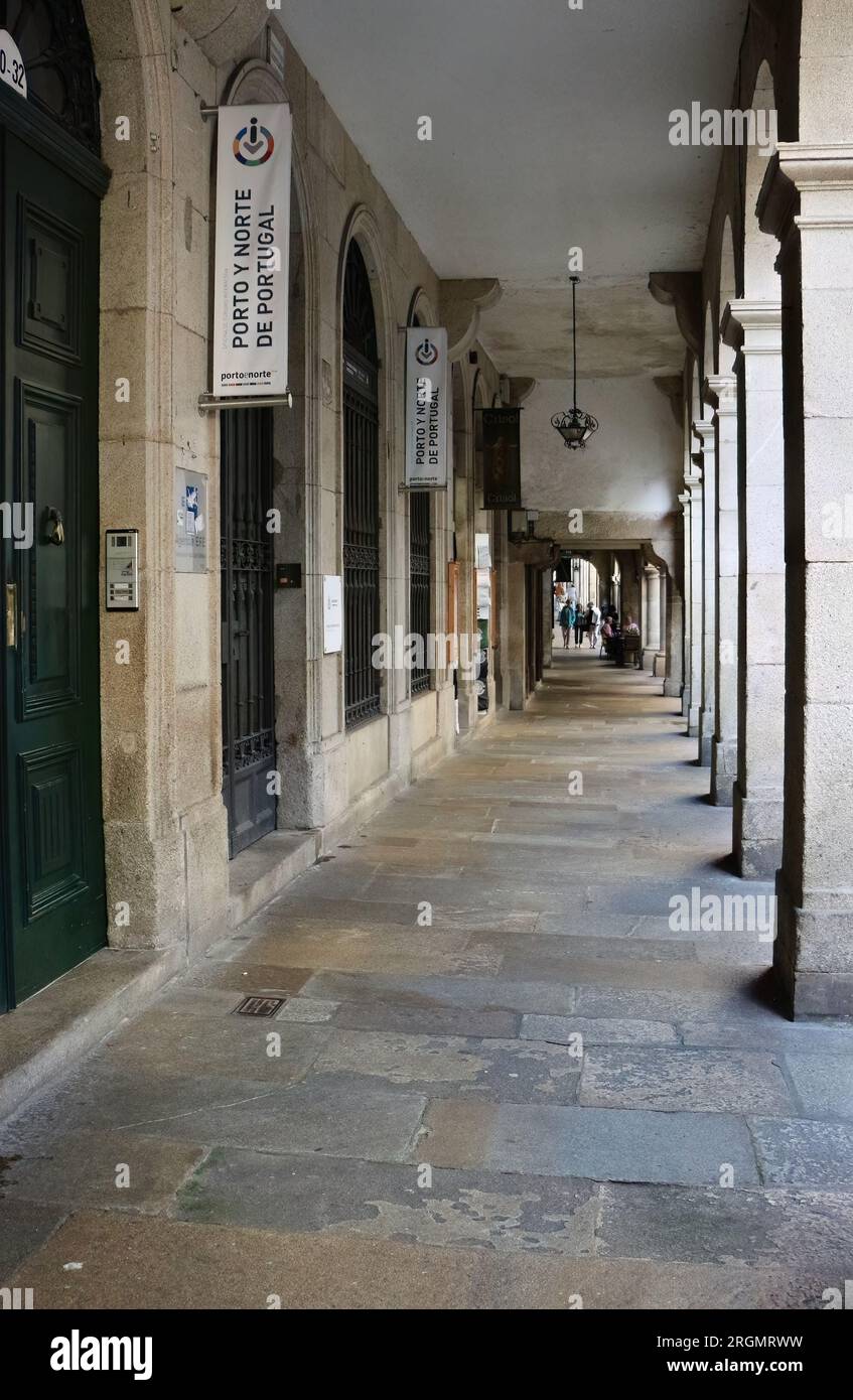 Historic city centre shopping arcade covered walkway with stone columns ...