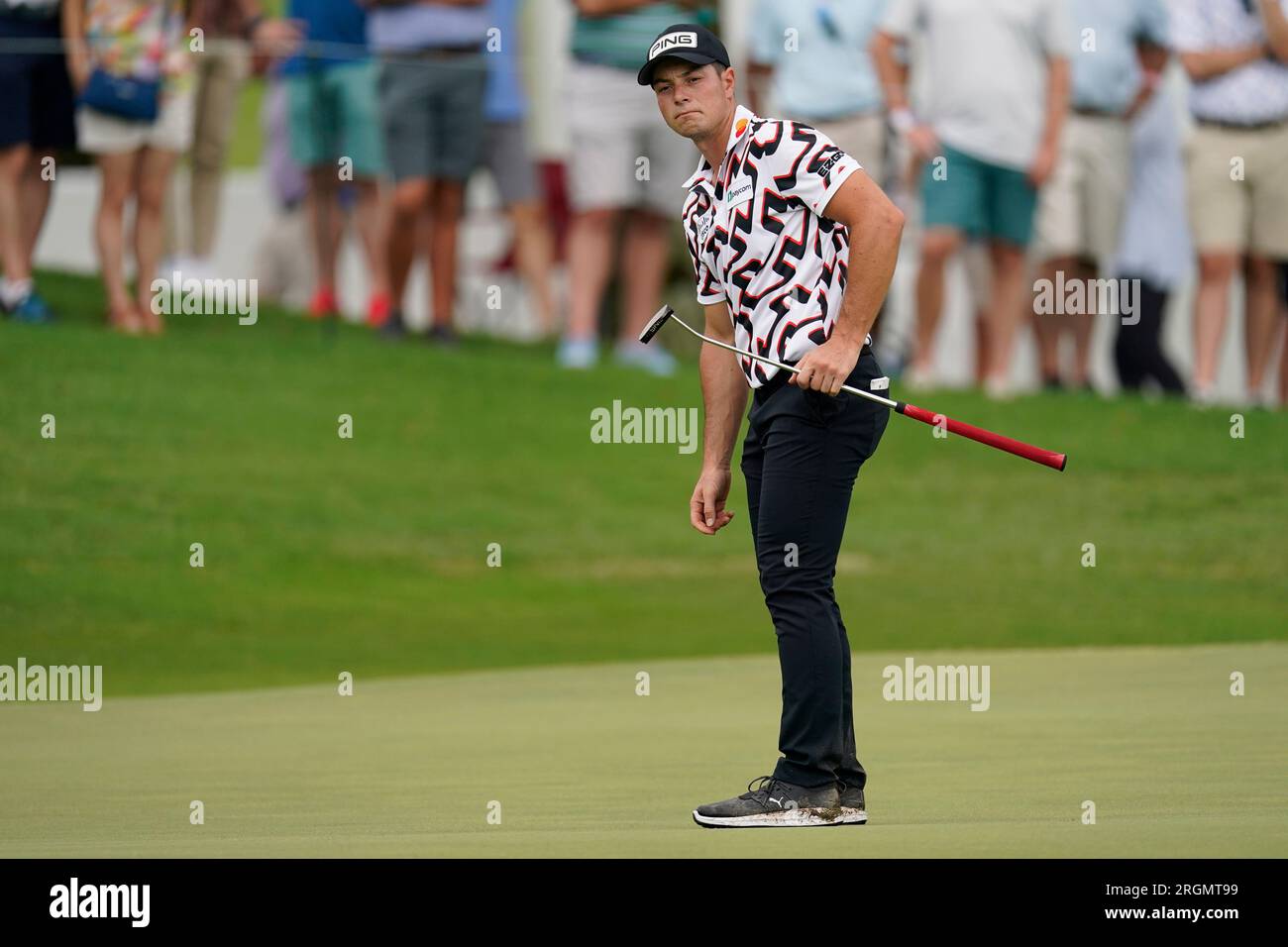 Viktor Hovland follows his putt on the ninth green during the first ...