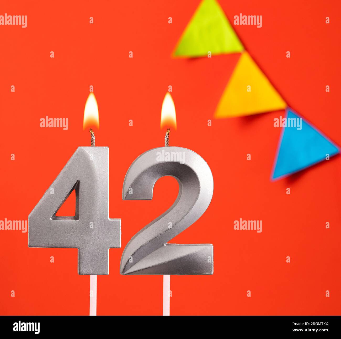 Birthday card - Number 42 candle in orange background Stock Photo - Alamy