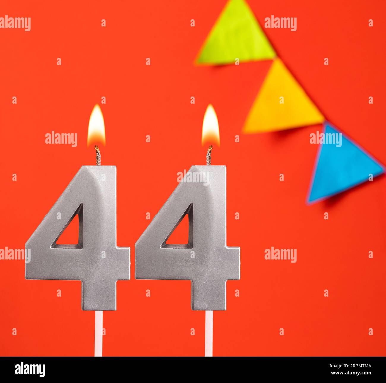 Birthday card - Number 44 candle in orange background Stock Photo - Alamy