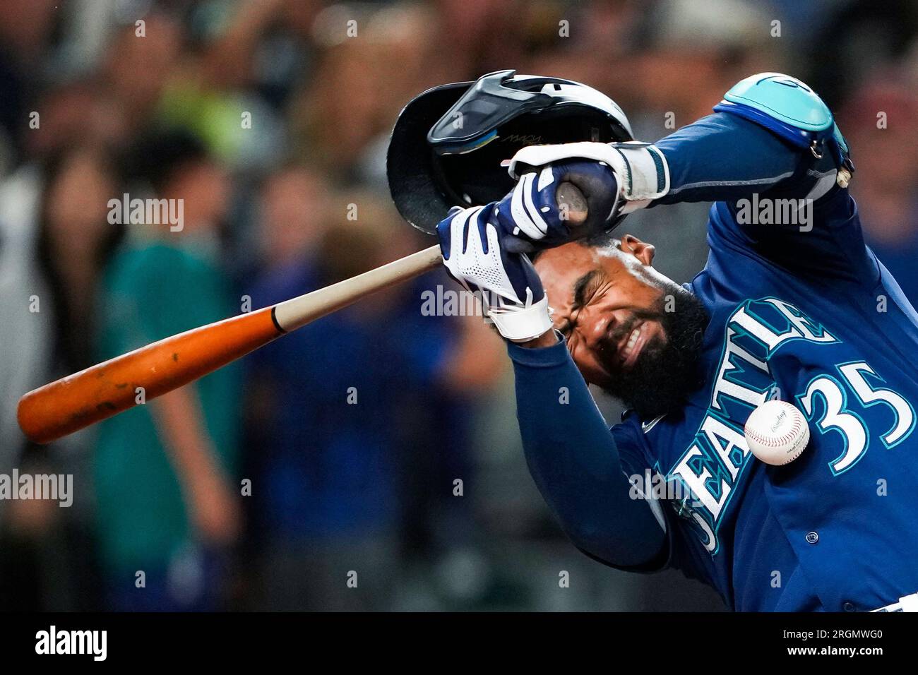 Seattle Mariners' Teoscar Hernandez is hit by a pitch from San Diego ...