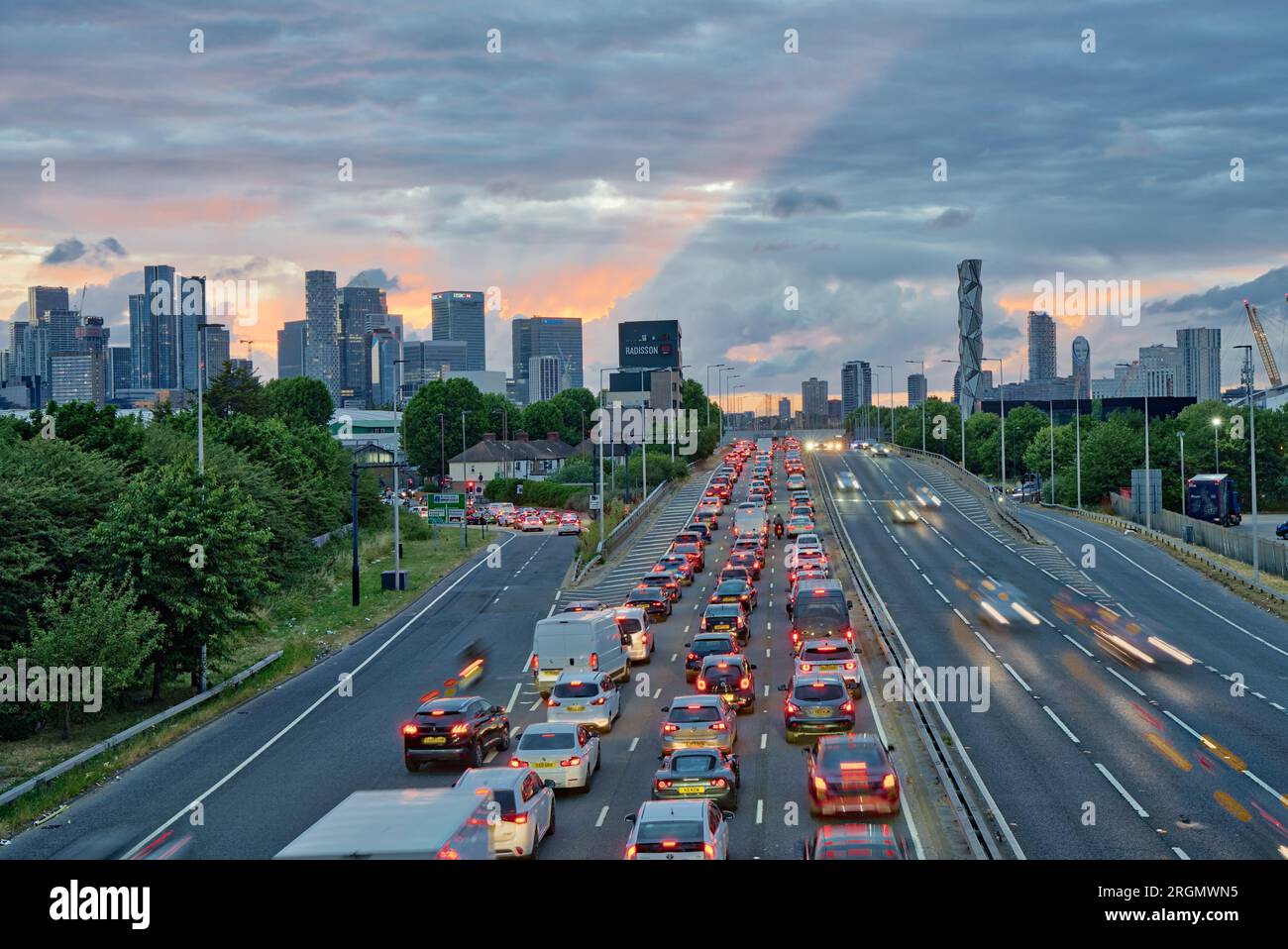 Sunshine at sunset broke through thick dark cloud over Docklands where ...