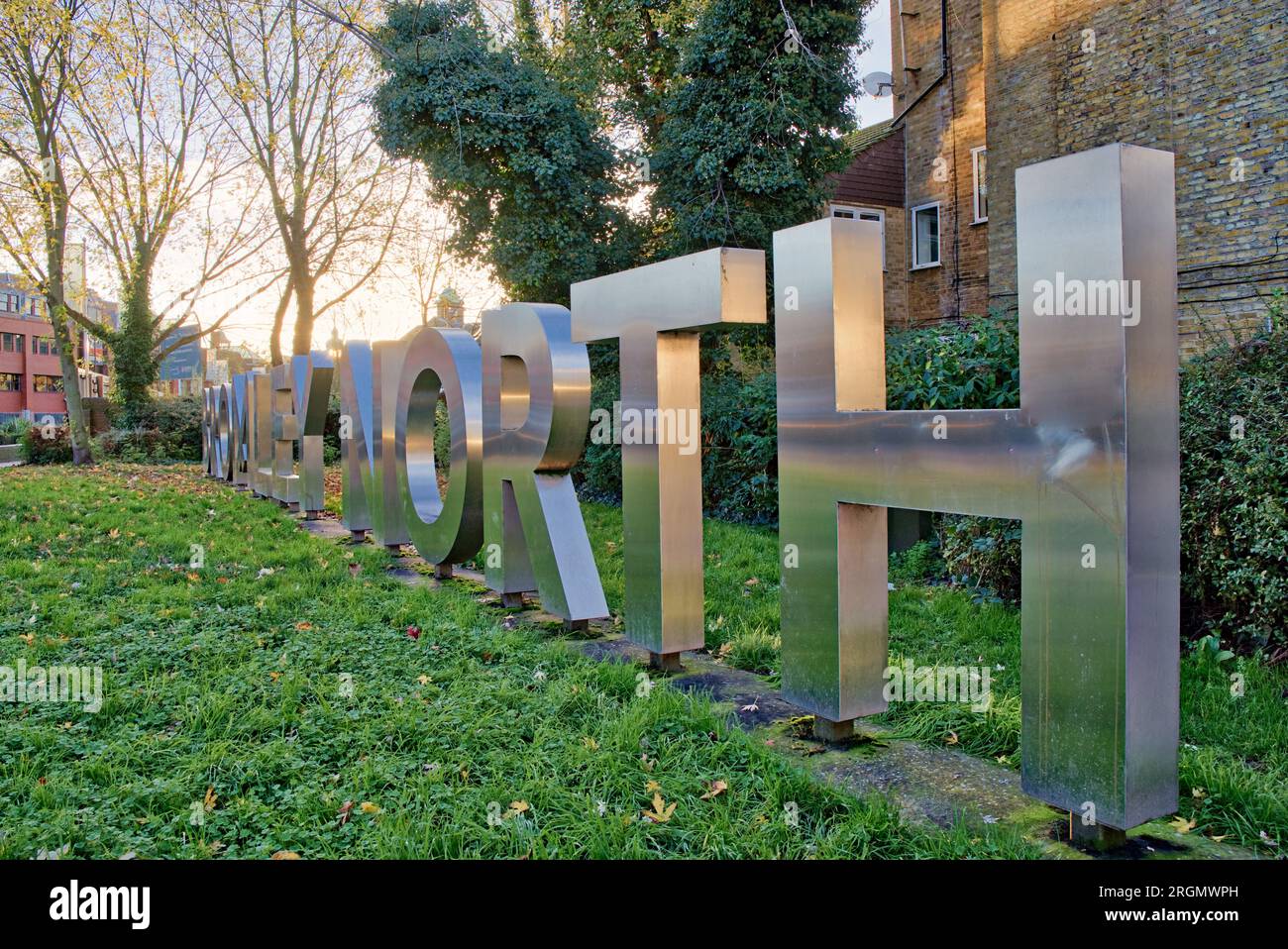 Bromley North signage erected in the garden with fallen tree leaves ...