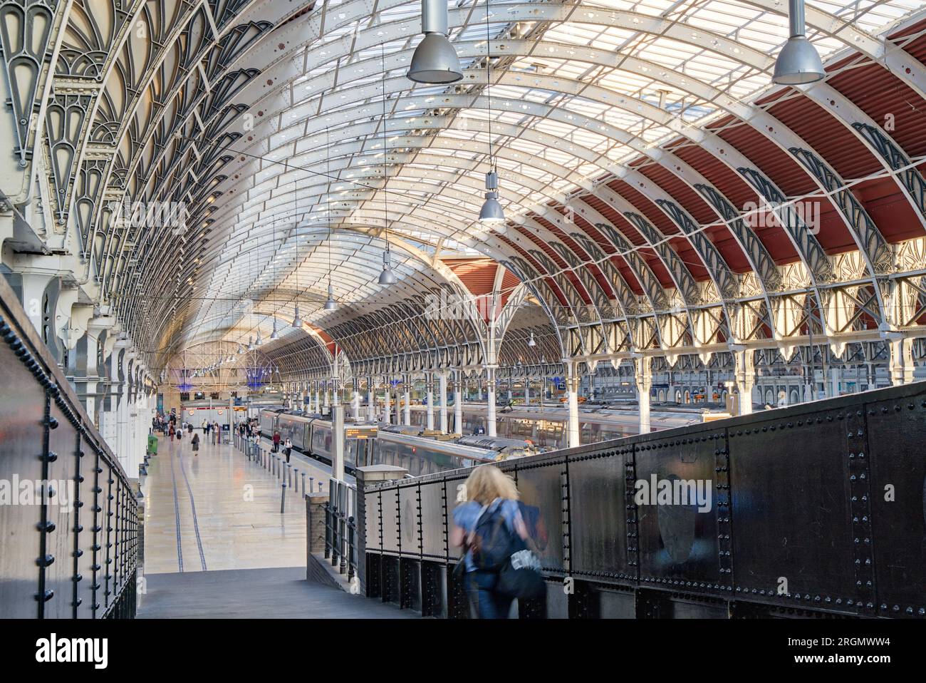 evening sun beam through arch roof top glasses onto Paddington station ...