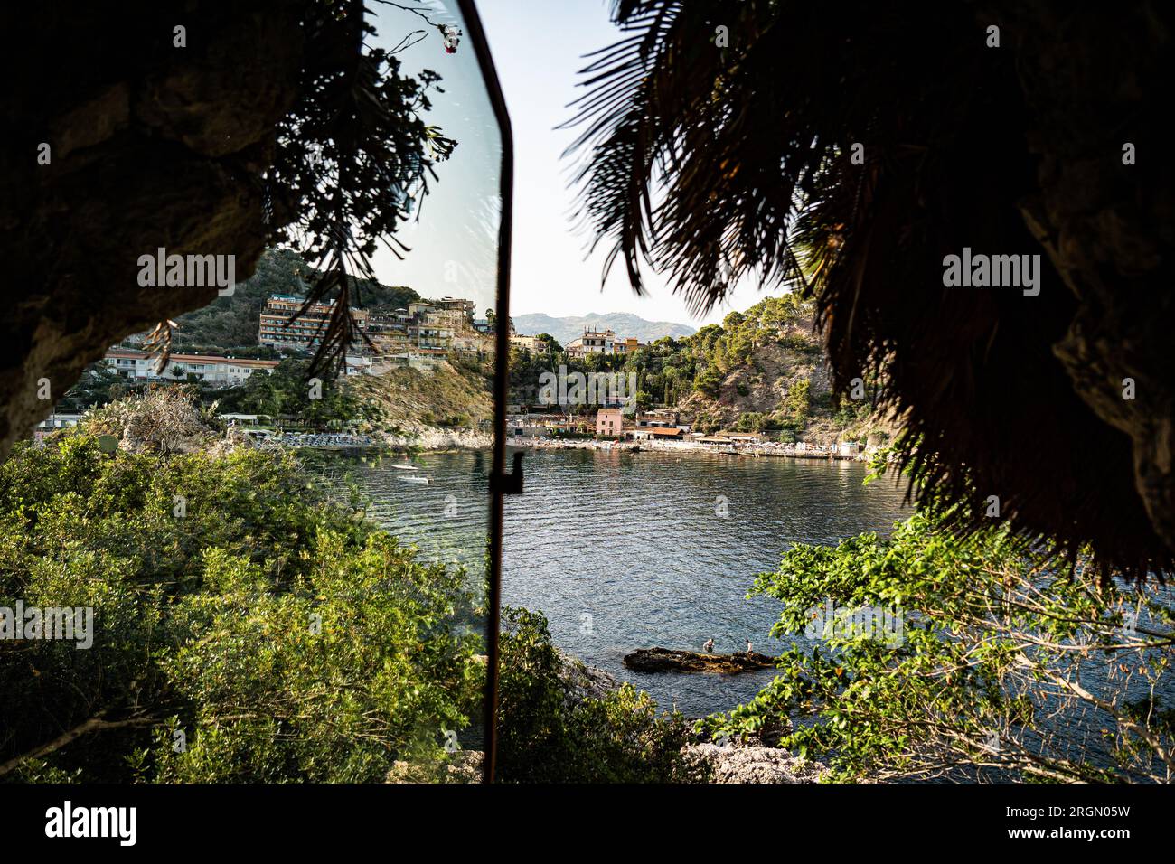 View seen from a window into the landscape of Taormina, Sicily in Italy ...