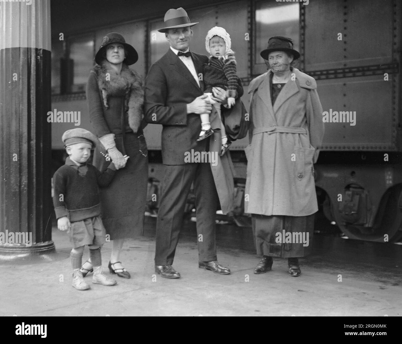 Walter Johnson with his wife, mother and 2 children at train station ca ...