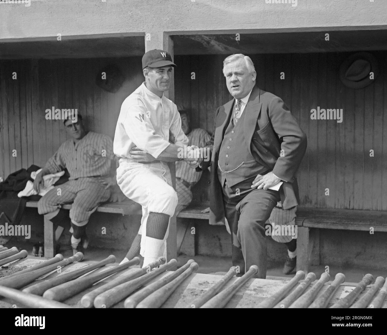Stanley Bucky Harris & John McGraw pose for a photograph in the dugout ...