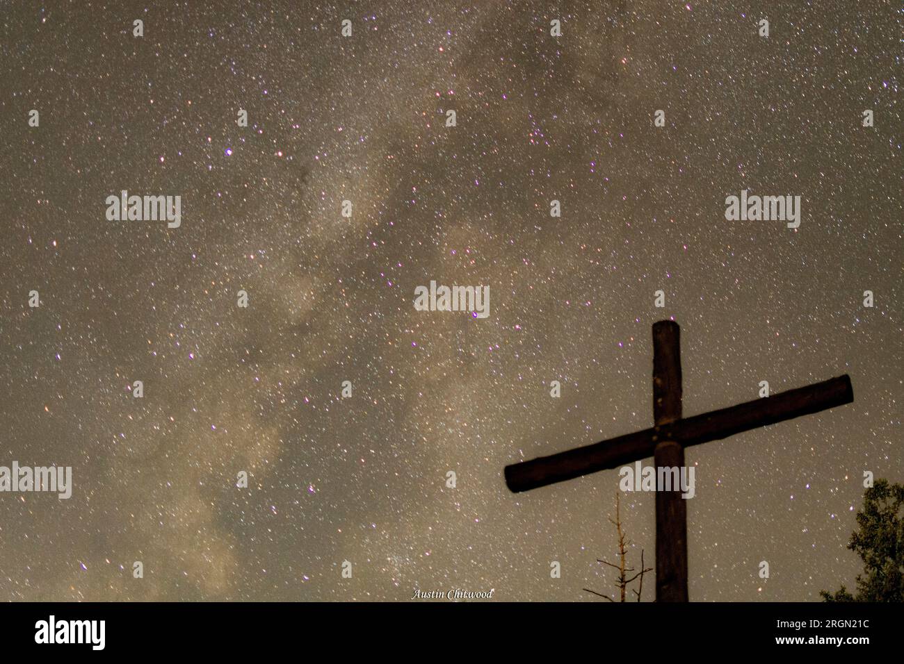 Cross on top of a mountain on a starry night Stock Photo - Alamy
