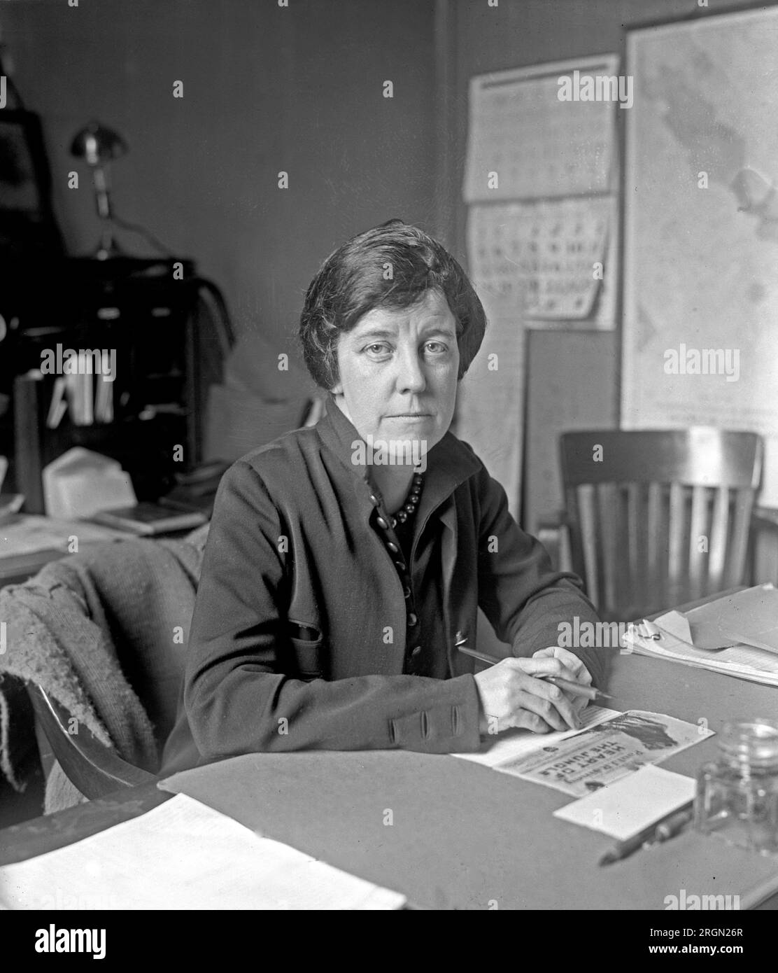 Sadie Leigh Lewis sitting behind a desk ca. 1925 Stock Photo - Alamy